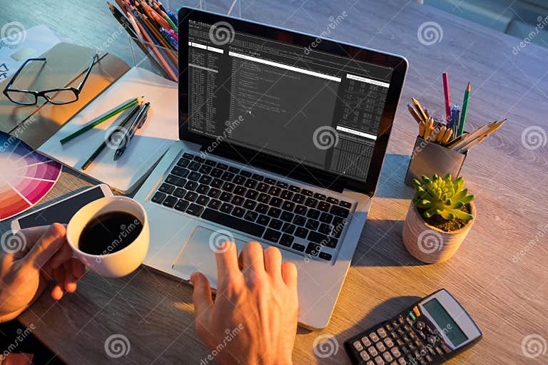 Hands of Caucasian Male Programmer Sitting at Desk and Using Laptop with Coding on Screen Stock ...