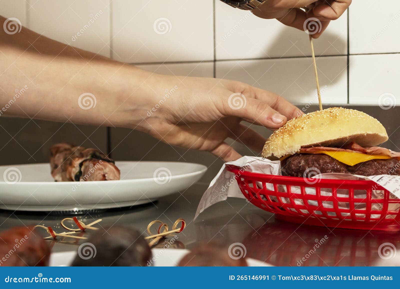 The Hands of a Chef Assembling a Beef Burger Cooking on Charcoal Grill ...