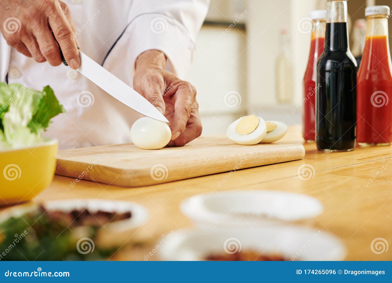 Chef cutting chicken eggs stock photo. Image of ingredient - 174265096