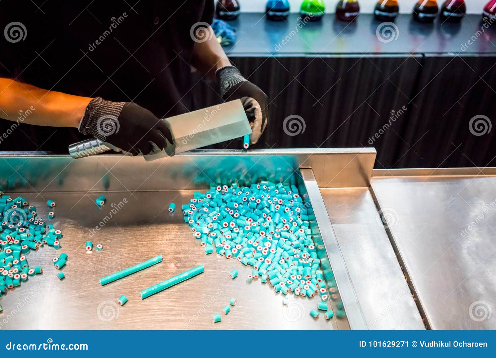 Hands of Chefs Cutting Colorful Sugar into Small Pieces. Stock Image ...