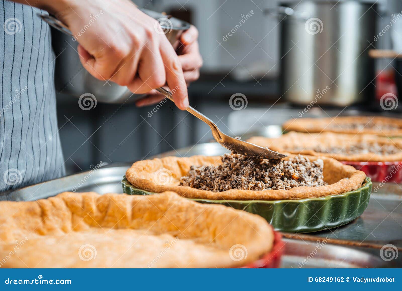 Hands of Cheif Cook Cooking and Putting Filling into Pie Stock Photo ...
