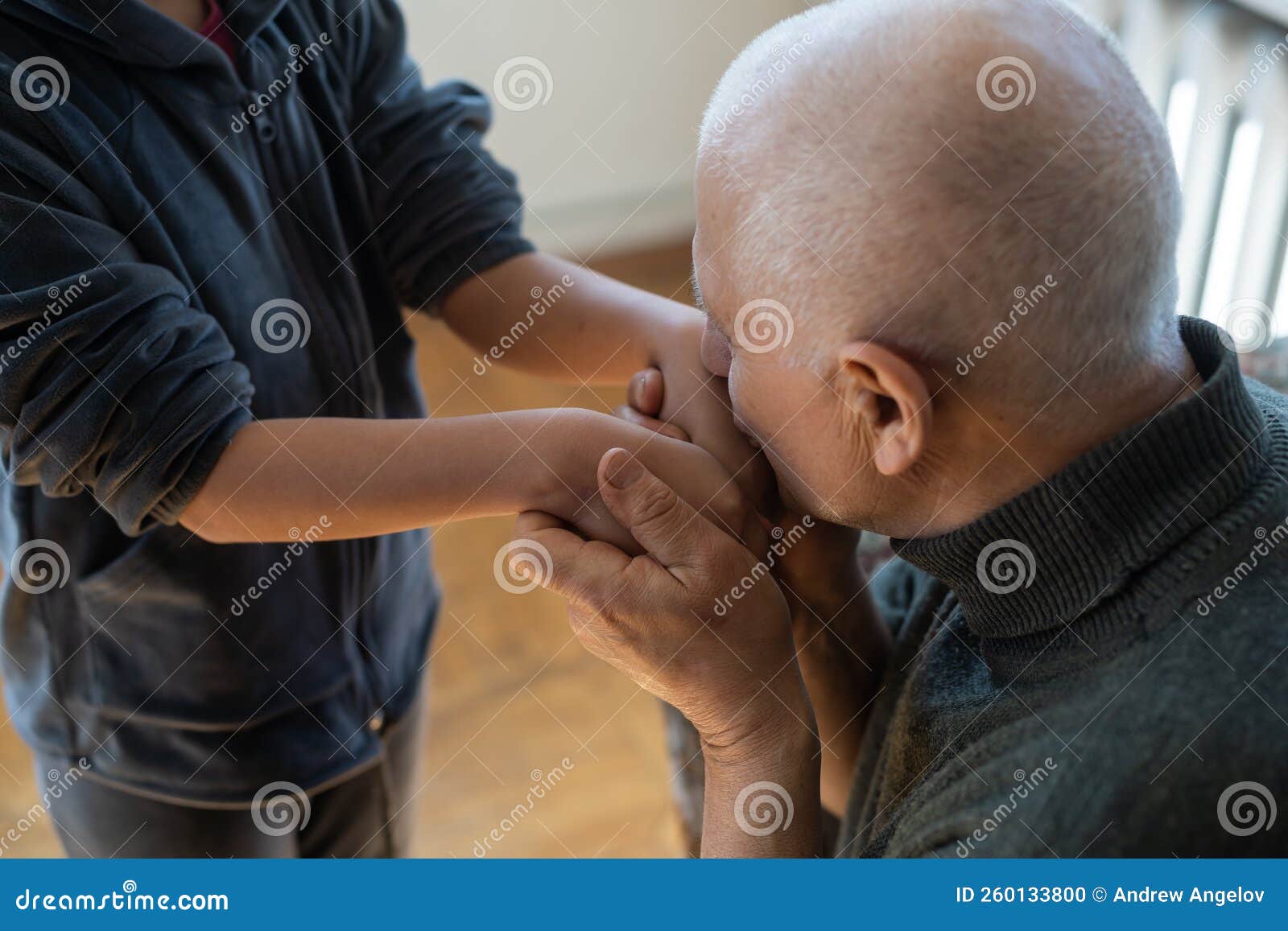 The Hands of the Child Embracing a Hand of the Old Man Stock Photo ...