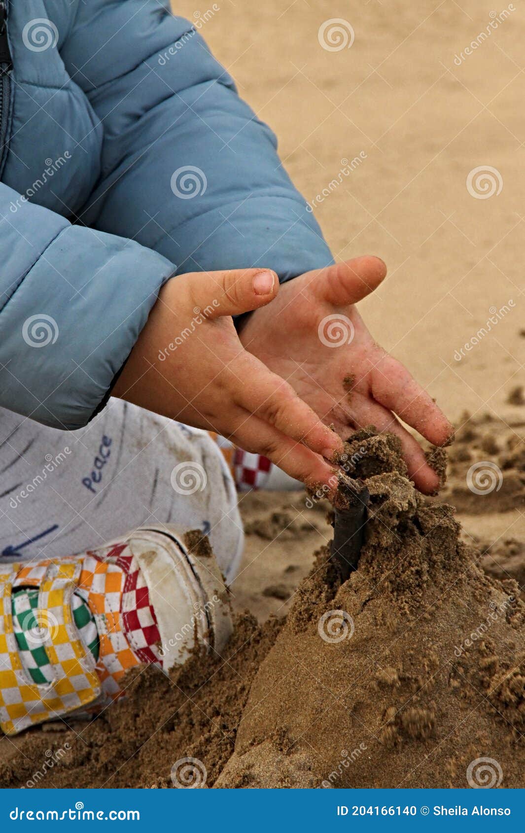 The Hands of a Child Playing with the Sand Stock Photo - Image of ...