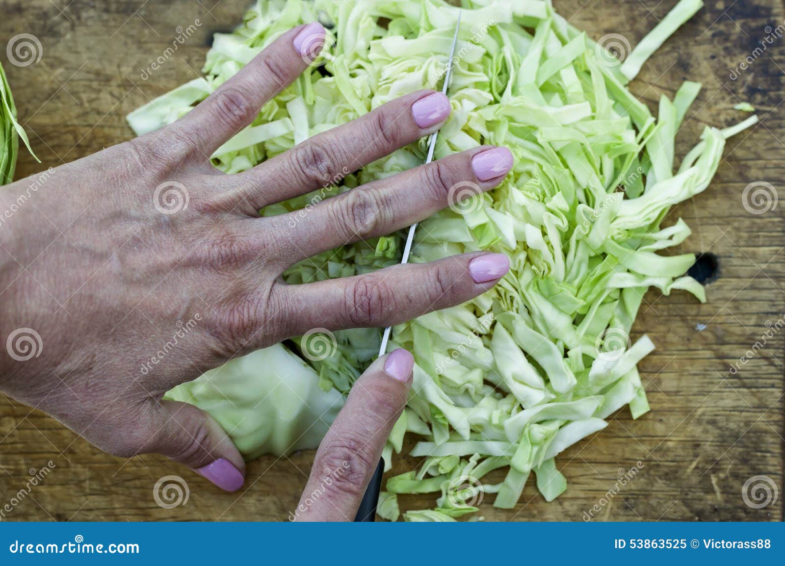 Hands Chopping Cabbage stock image. Image of utensil - 53863525