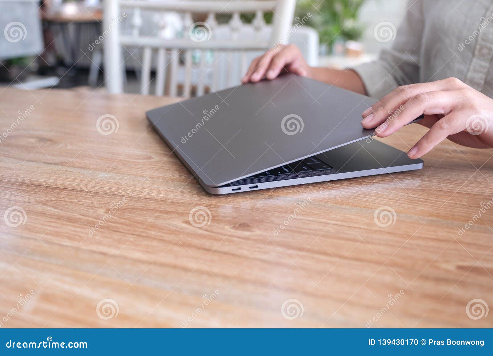 Hands Close And Open A Laptop Computer On Table After Finished Using It ...