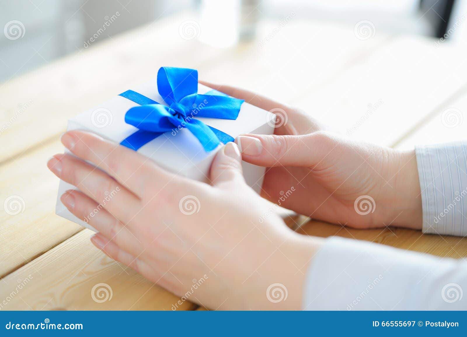 Hands Closeup. Gift with Blue Ribbon in Hands. Stock Image - Image of ...