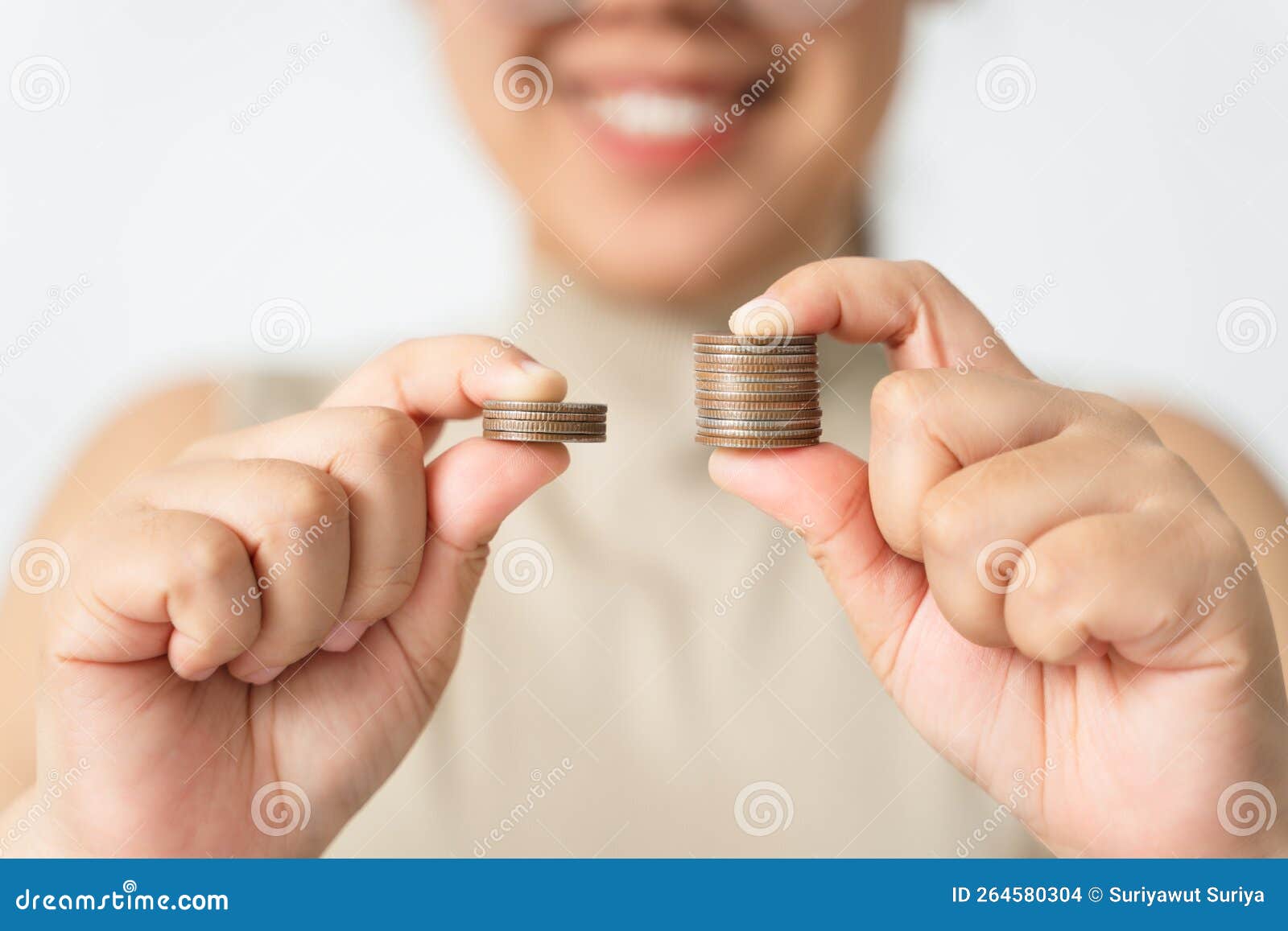 Hands Compare Two Piles of Coins of Different Sizes Stock Photo - Image ...