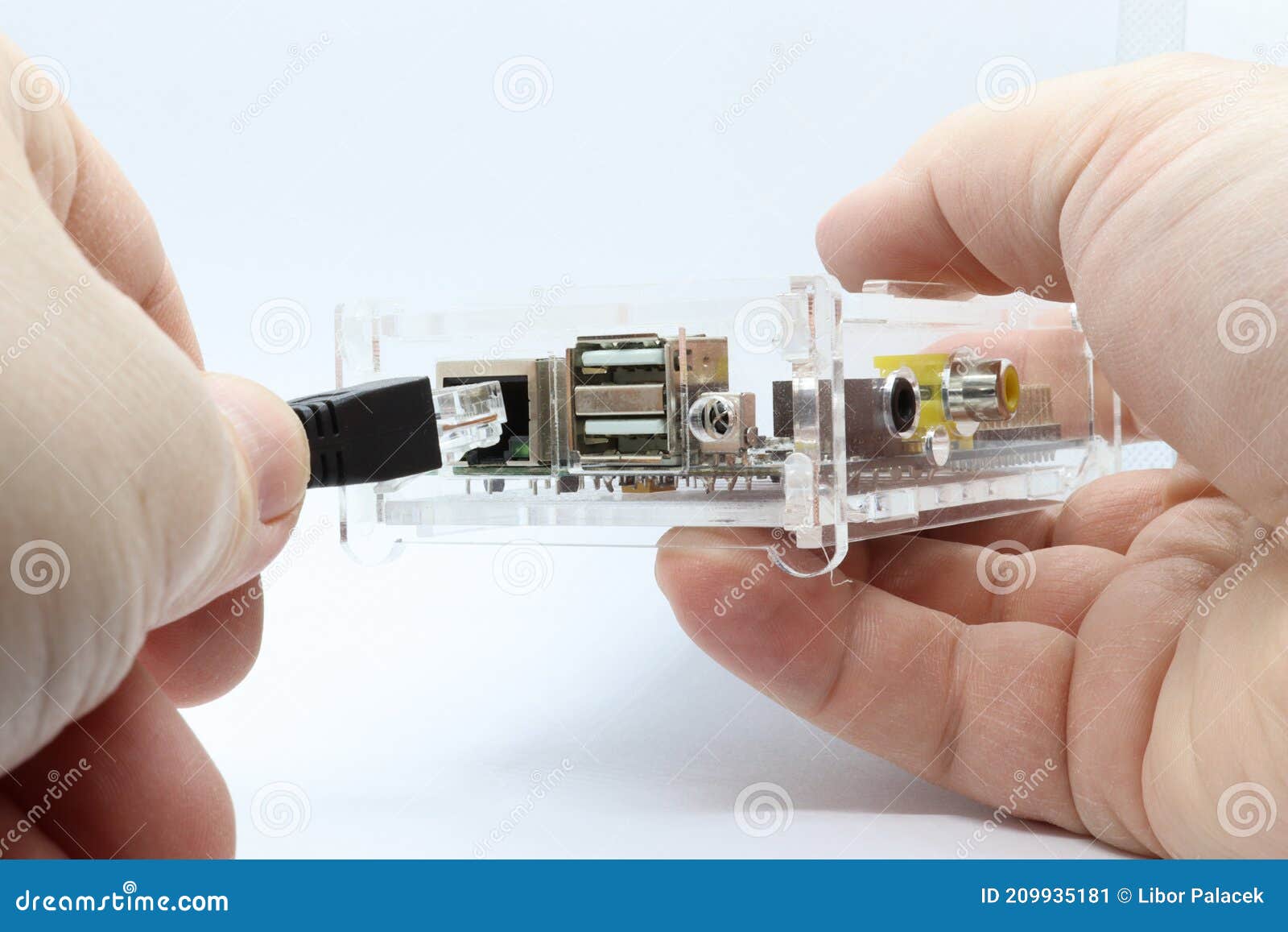 Hands Connecting a Computer Network Cable To a Mini PC Stock Image ...