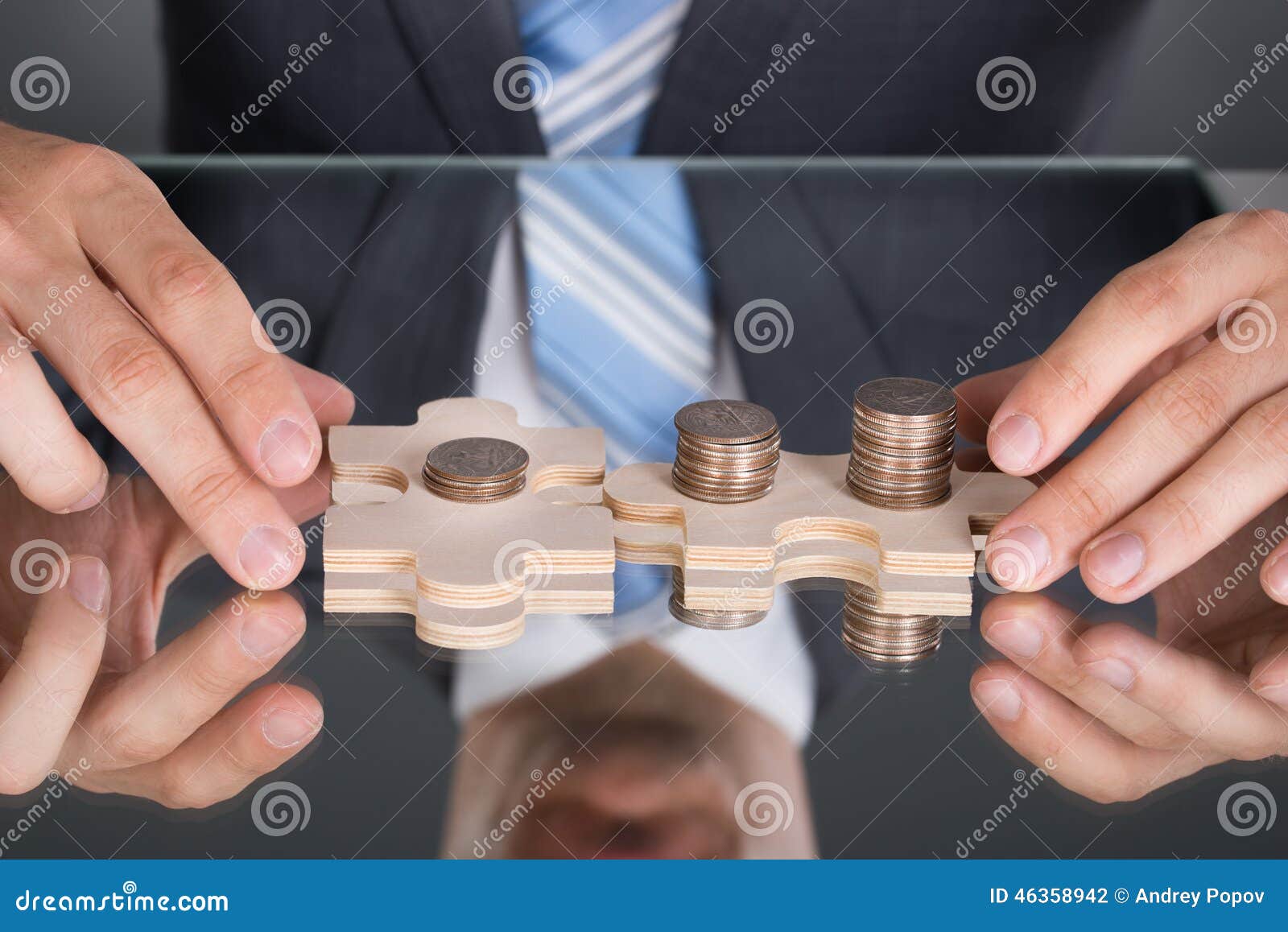 Hands Connecting Puzzle Pices with Coins Stock Photo - Image of answers ...