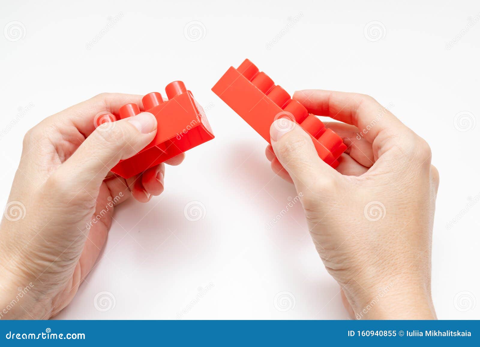 Hands Constructing from Colorful Toy Plastic Bricks, Blocks for ...