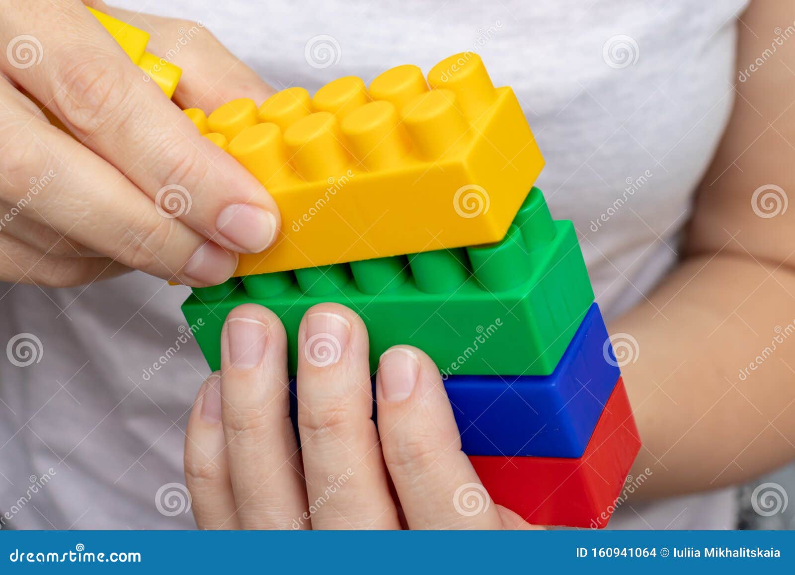 Hands Constructing from Colorful Toy Plastic Bricks, Blocks for ...