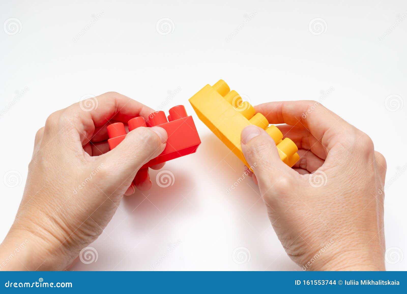 Hands Constructing from Colorful Toy Plastic Bricks, Blocks for ...
