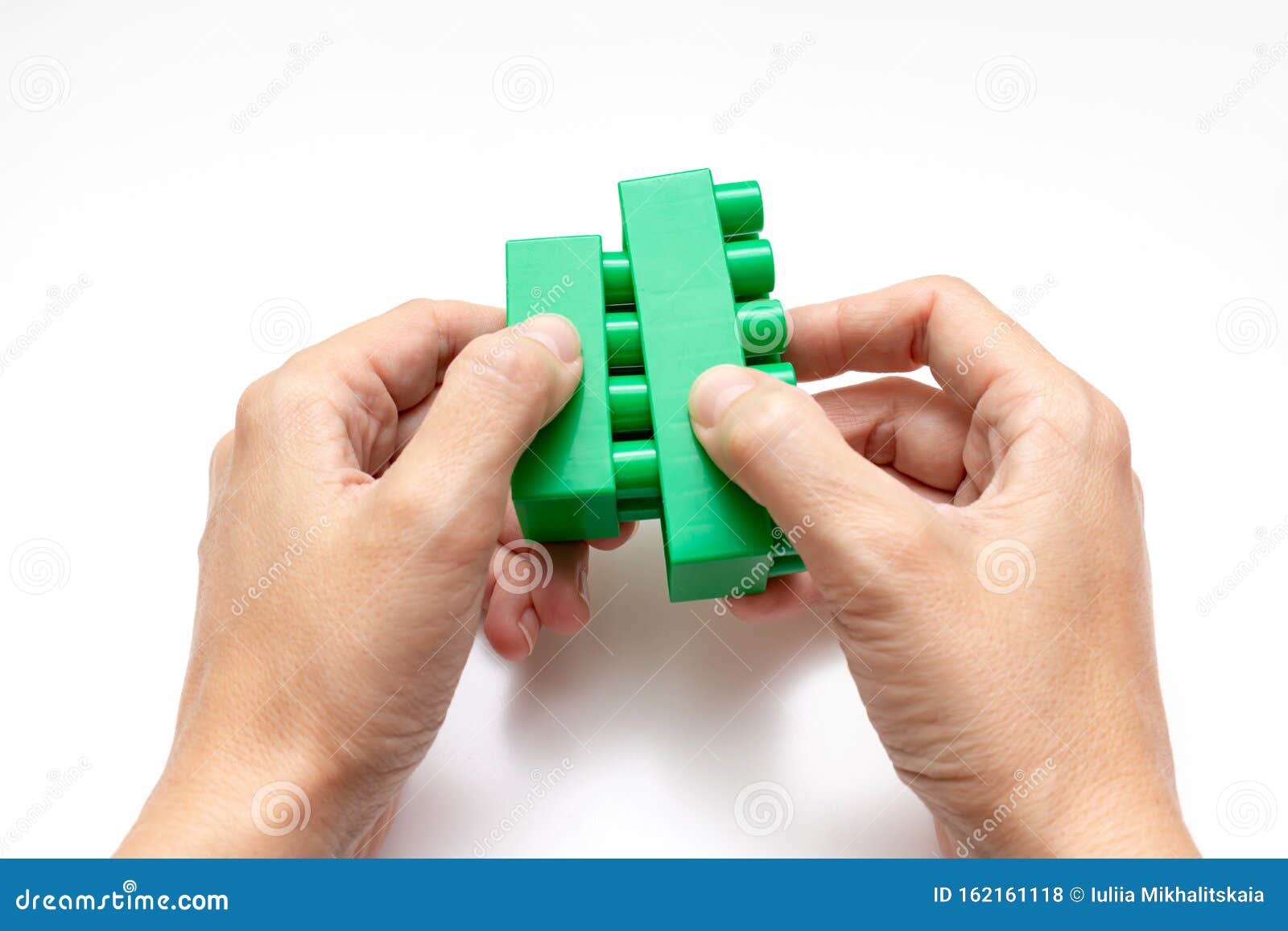 Hands Constructing from Colorful Toy Plastic Bricks, Blocks for ...