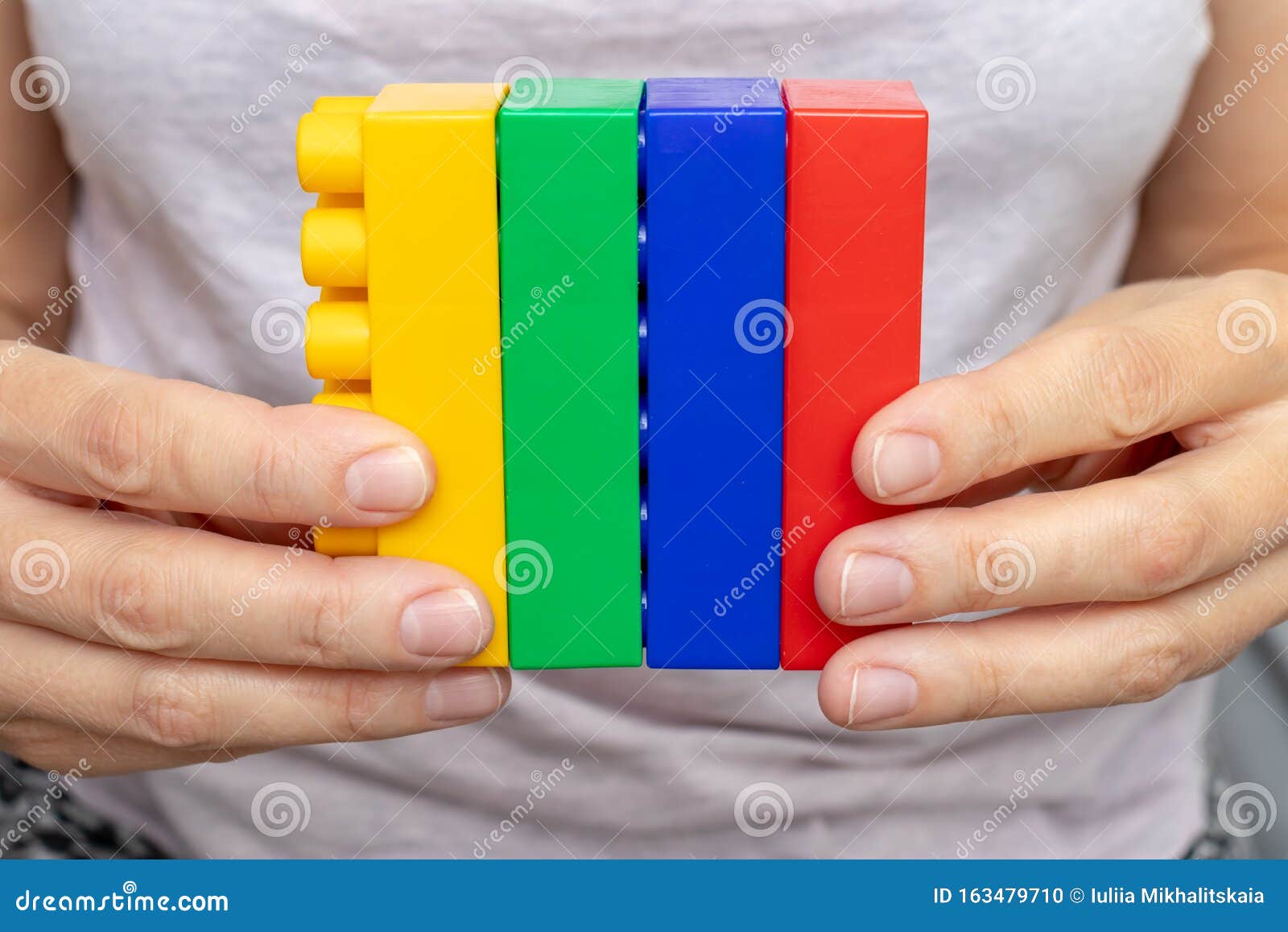Hands Constructing from Colorful Toy Plastic Bricks, Blocks for ...