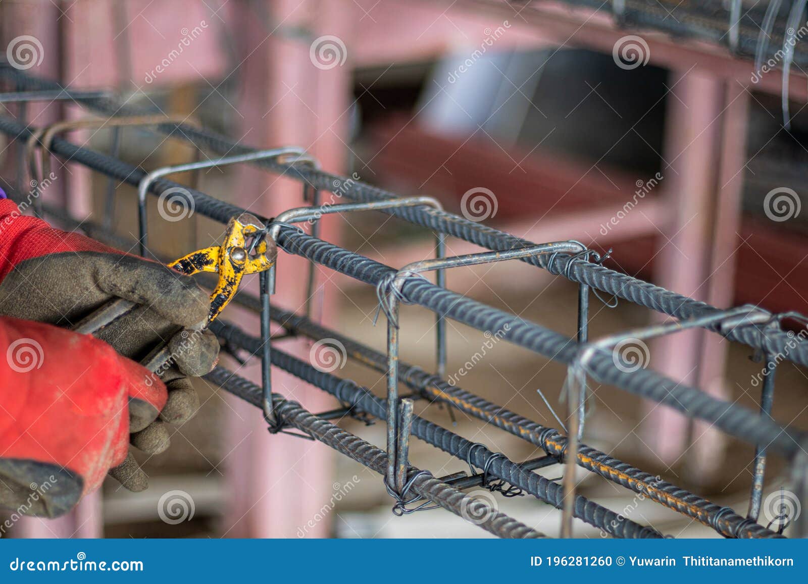 The Hands of Construction Workers Using Using Steel Wire To Bind Steel ...