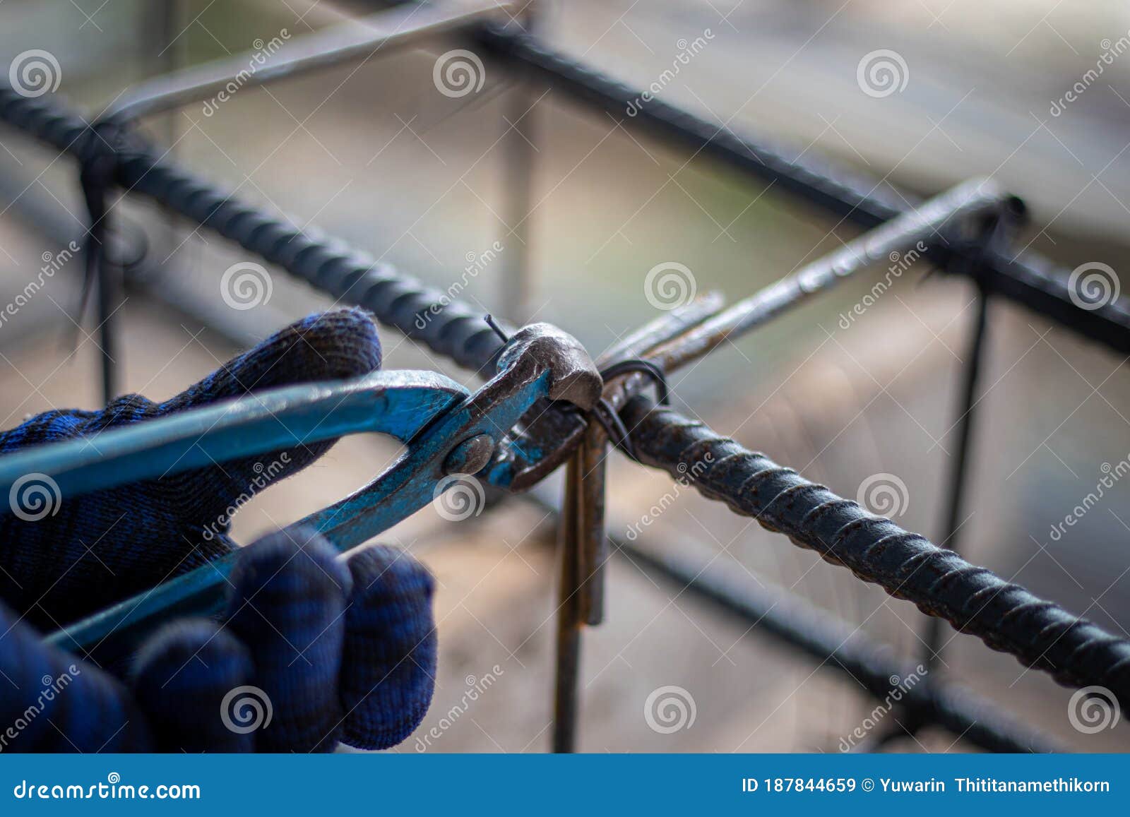 The Hands of Construction Workers Using Steel Wire To Bind Steel Bars ...