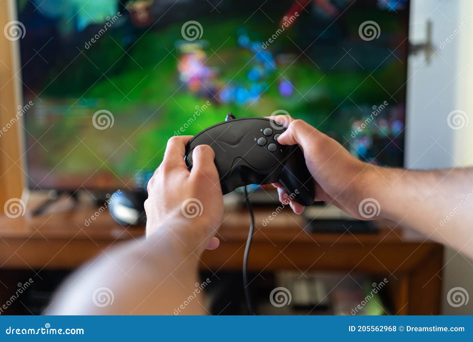 Hands with Controller on it Playing Video Games on TV Stock Photo ...