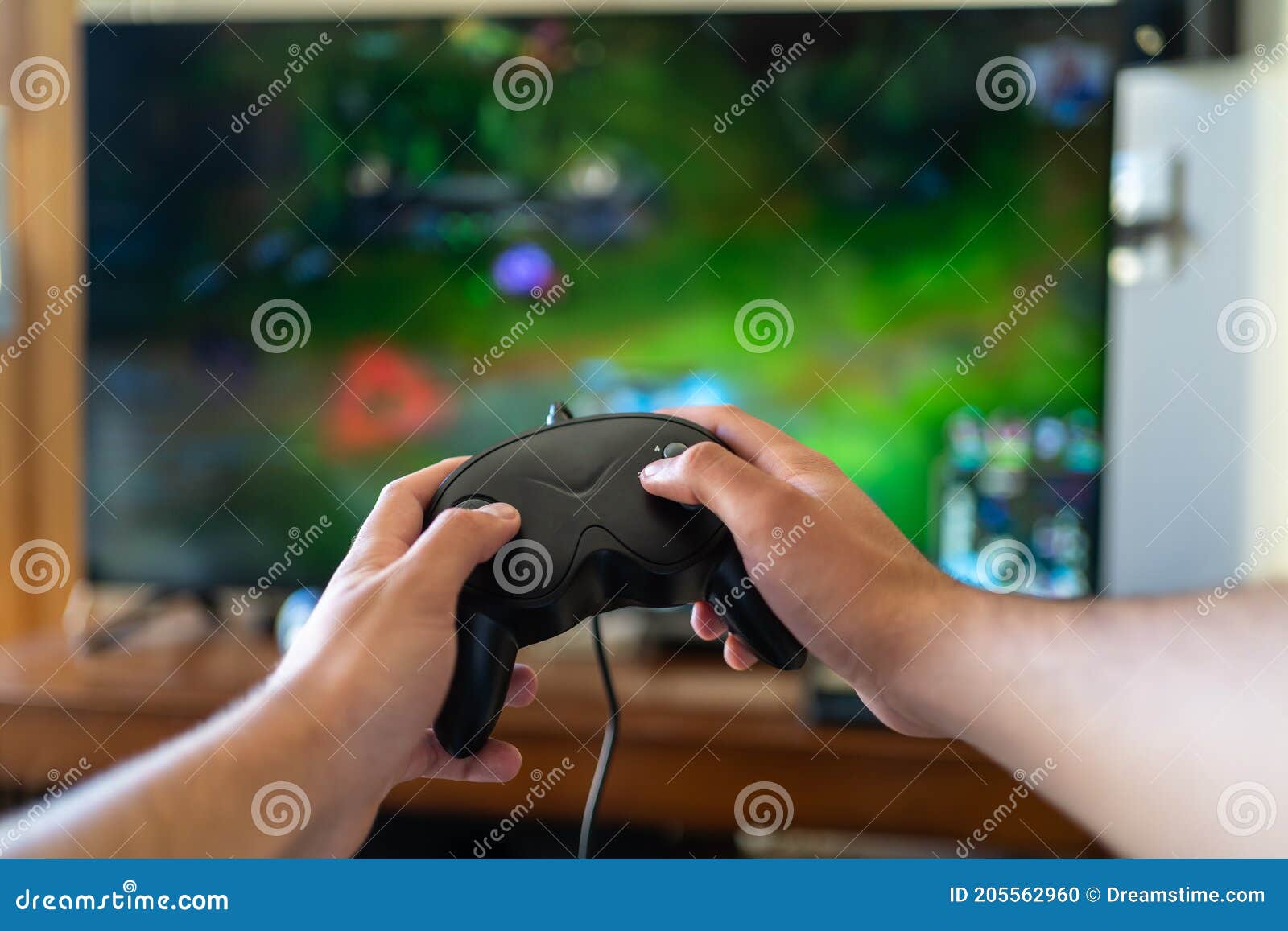 Hands with Controller on it Playing Video Games on TV Stock Photo ...