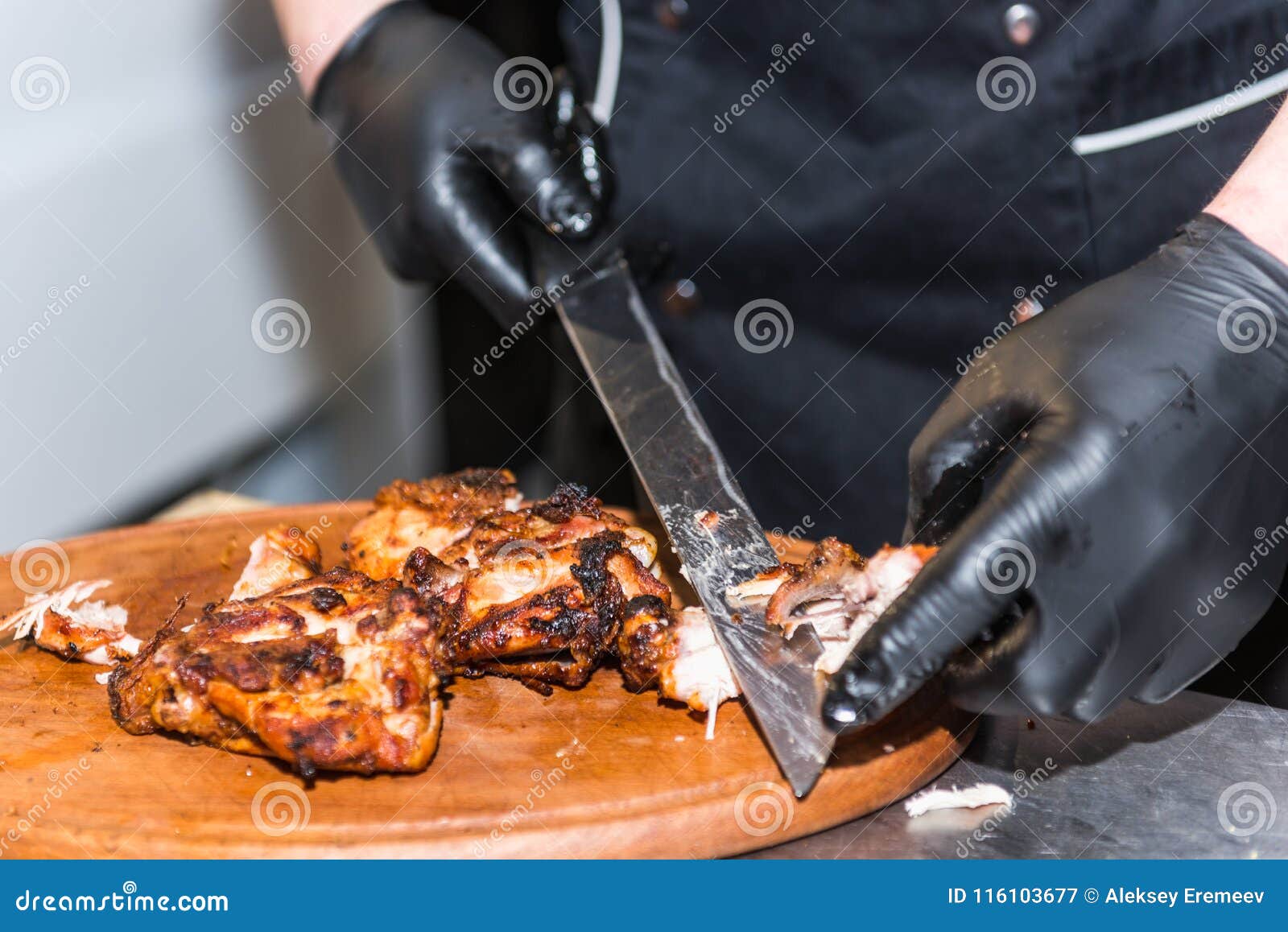 Hands cook cut fried meat stock image. Image of dish - 116103677