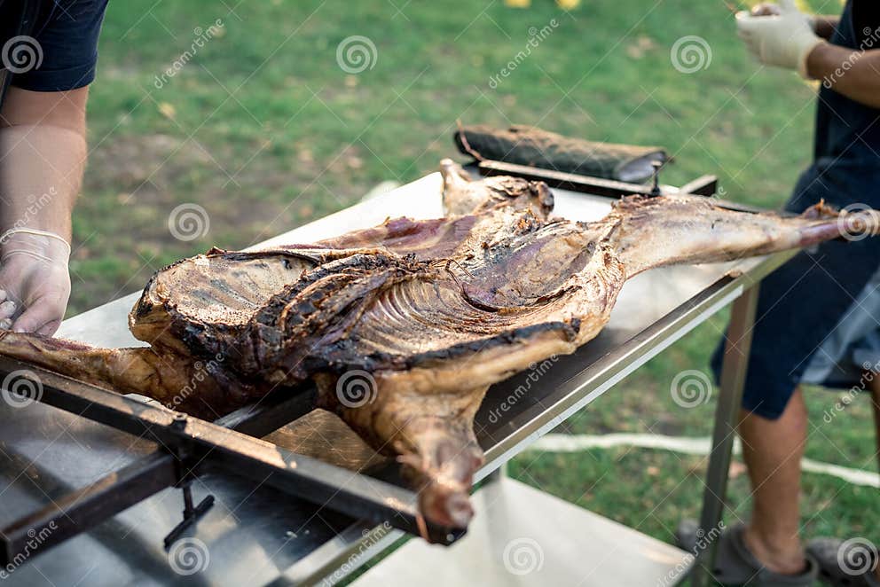 The Hands of the Cook Cut the Greased Carcass of the Rabbit Stock Image ...