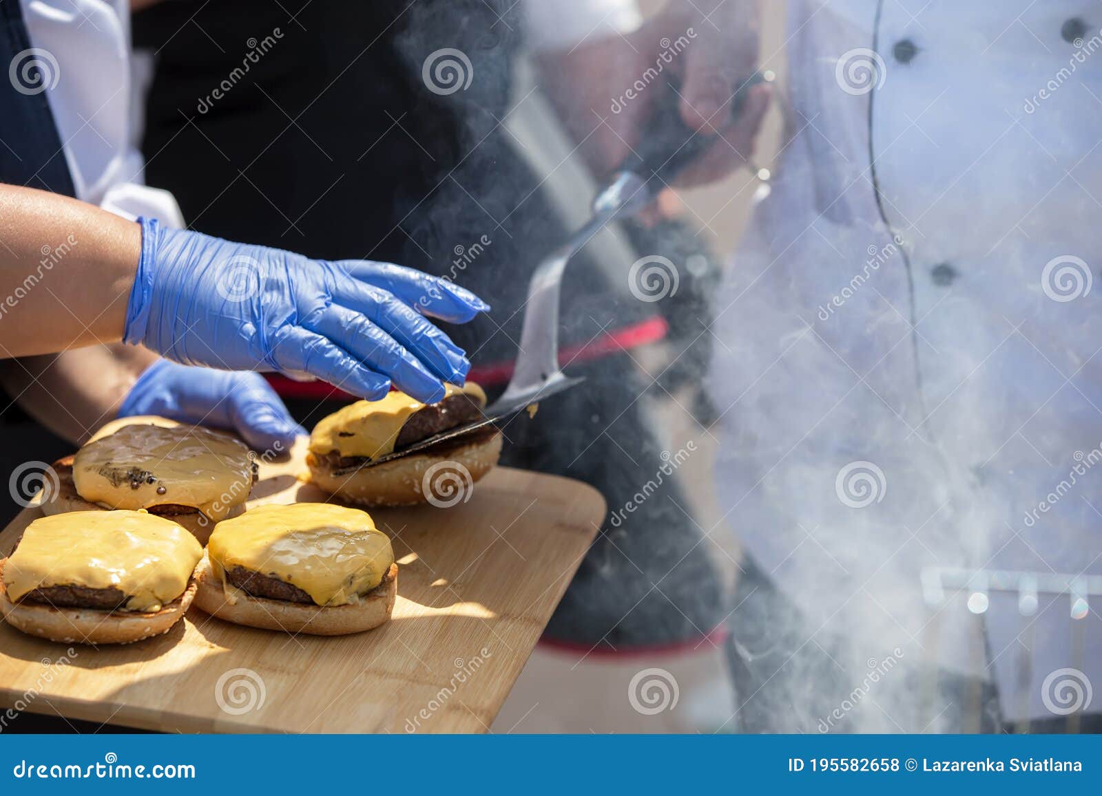 The Hands of the Cook Make a Hamburger Stock Photo - Image of onions ...