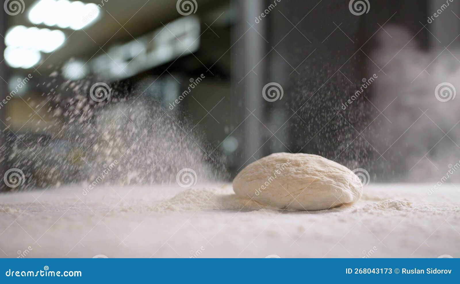 A Male Baker Throws Raw Dough into Flour in a Restaurant Kitchen. Close ...