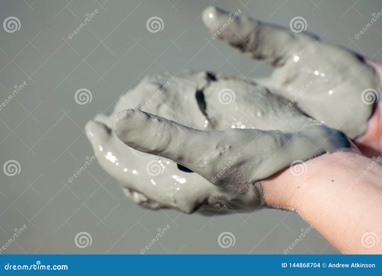 Hands Covered with Grey Mud, Held Open and Face Up - Close Up Stock ...
