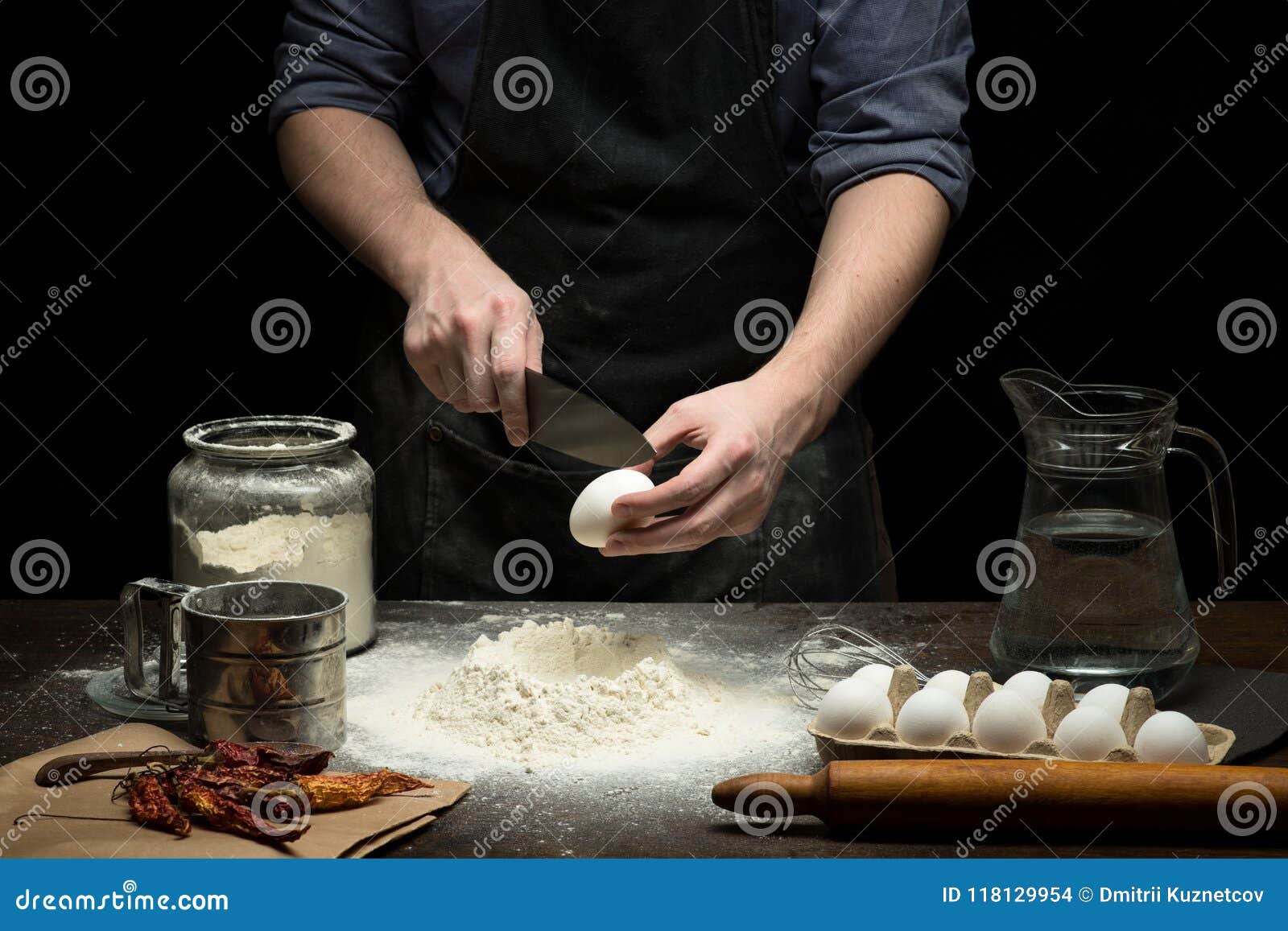 Hands are Cracking an Egg into Flour To Make Dough Stock Photo - Image ...