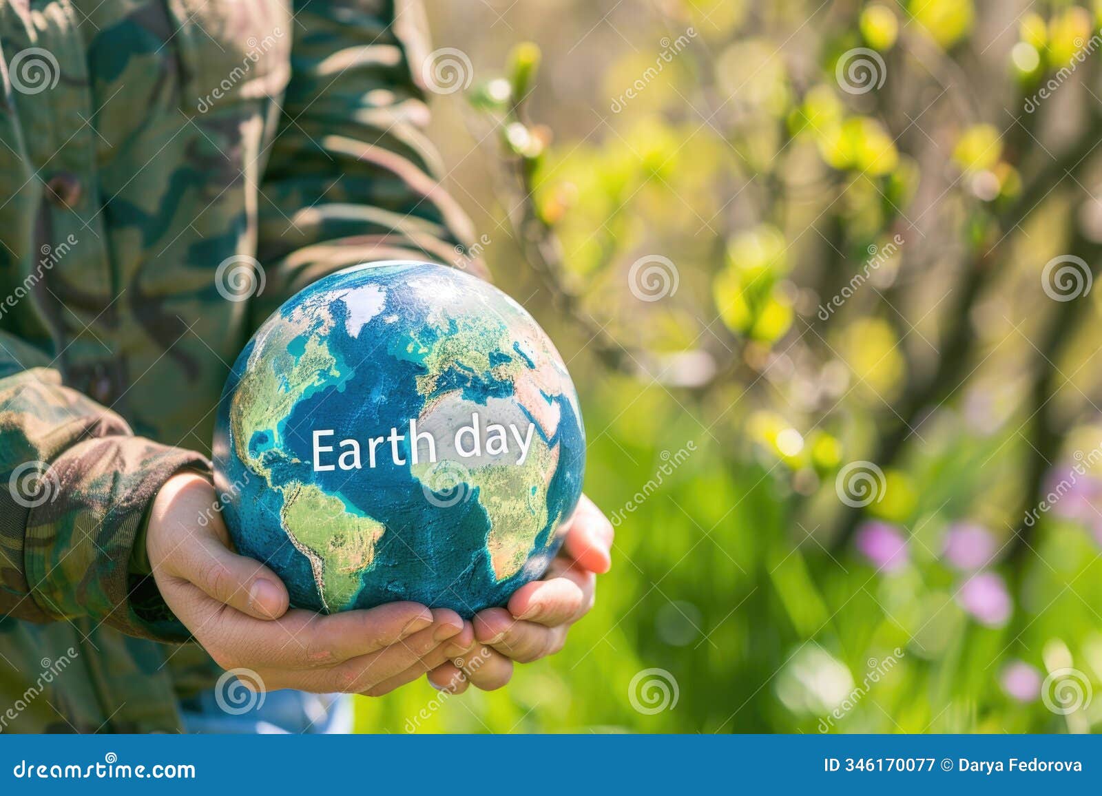 Hands Cradling Earth Globe on Greenery for Earth Day Stock Image ...