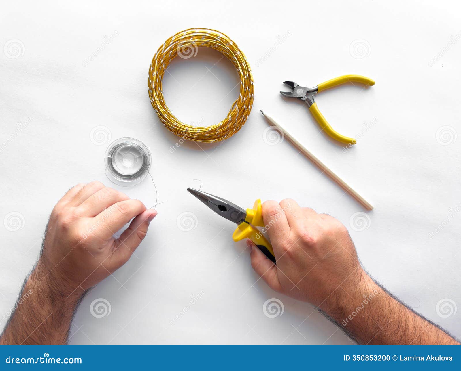 Hands Crafting Wire Jewelry with Tools on White Background Stock Photo ...