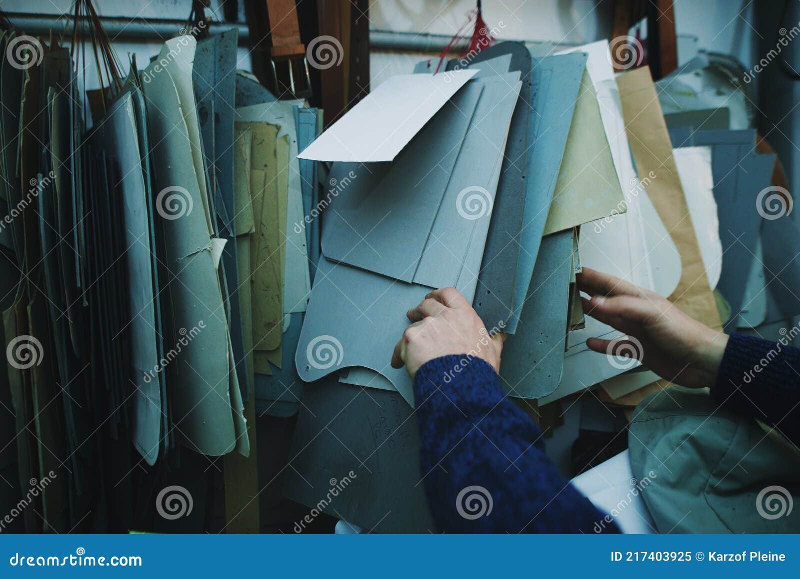 Hands of Craftsman Choose Hanging Paper Pattern Stock Image - Image of ...