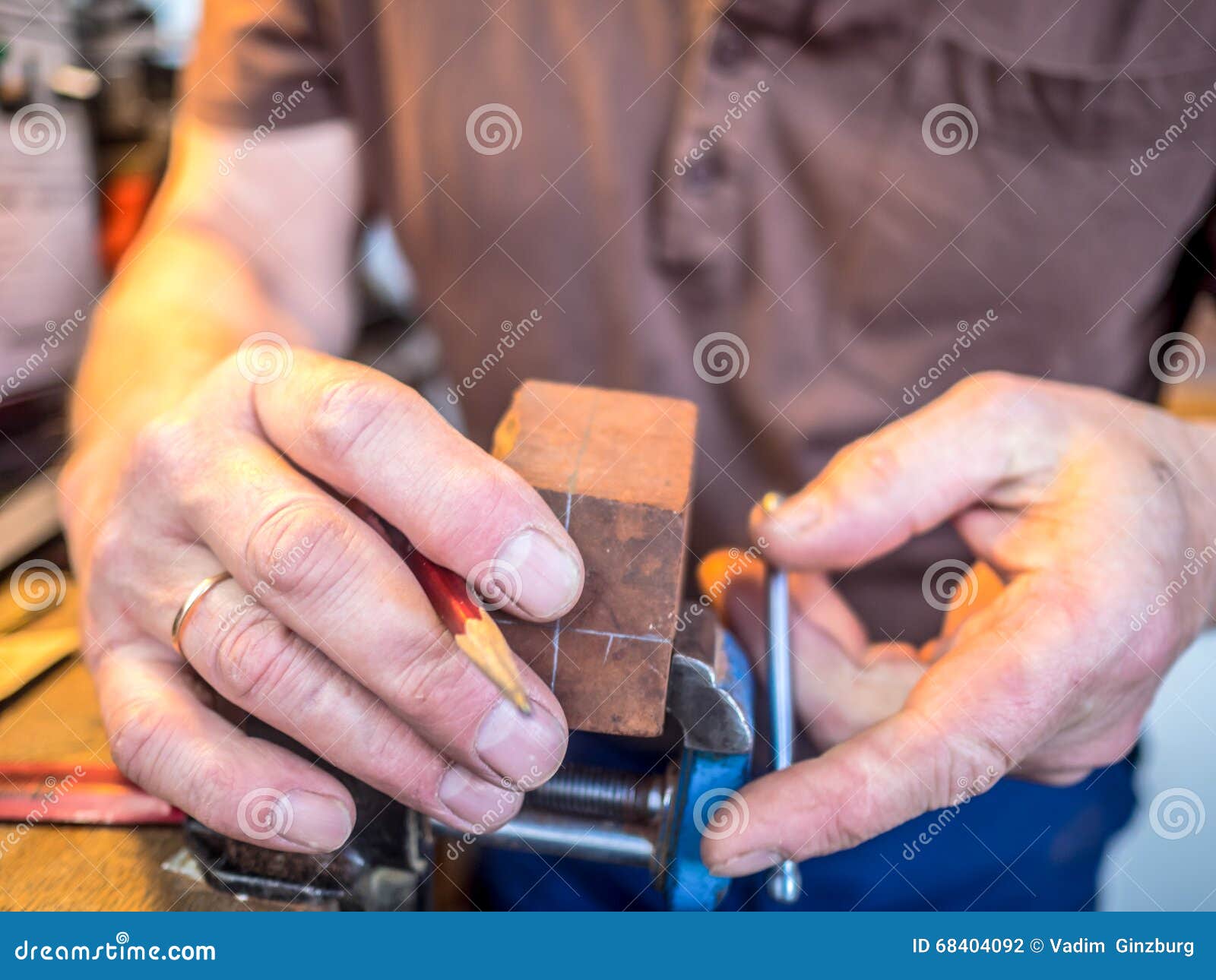 Hands of the craftsman stock photo. Image of metallic - 68404092