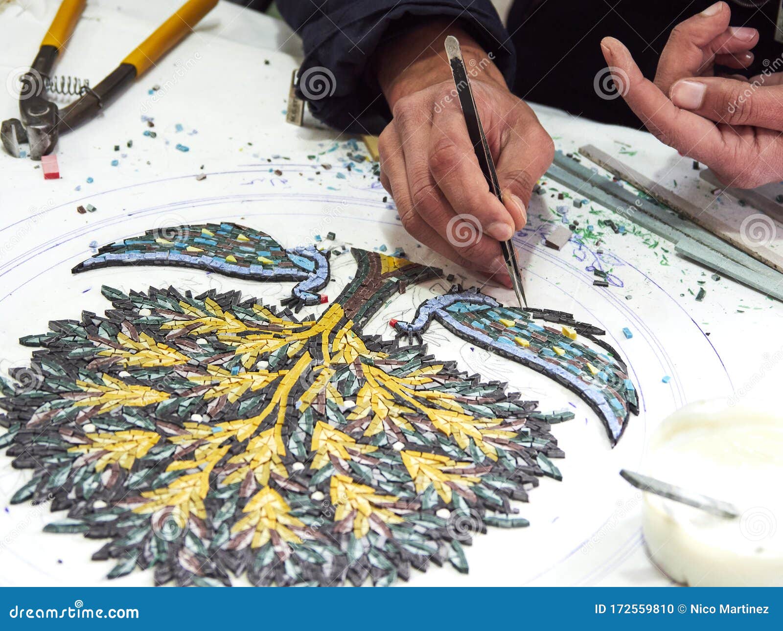 Hands creating a mosaic editorial image. Image of classic - 172559810