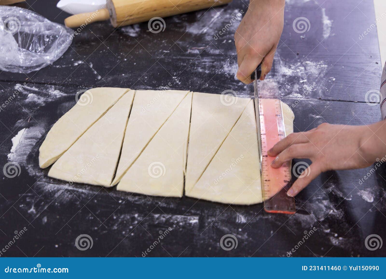 Hands Cut the Dough into Triangles Using a Ruler Stock Photo - Image of ...