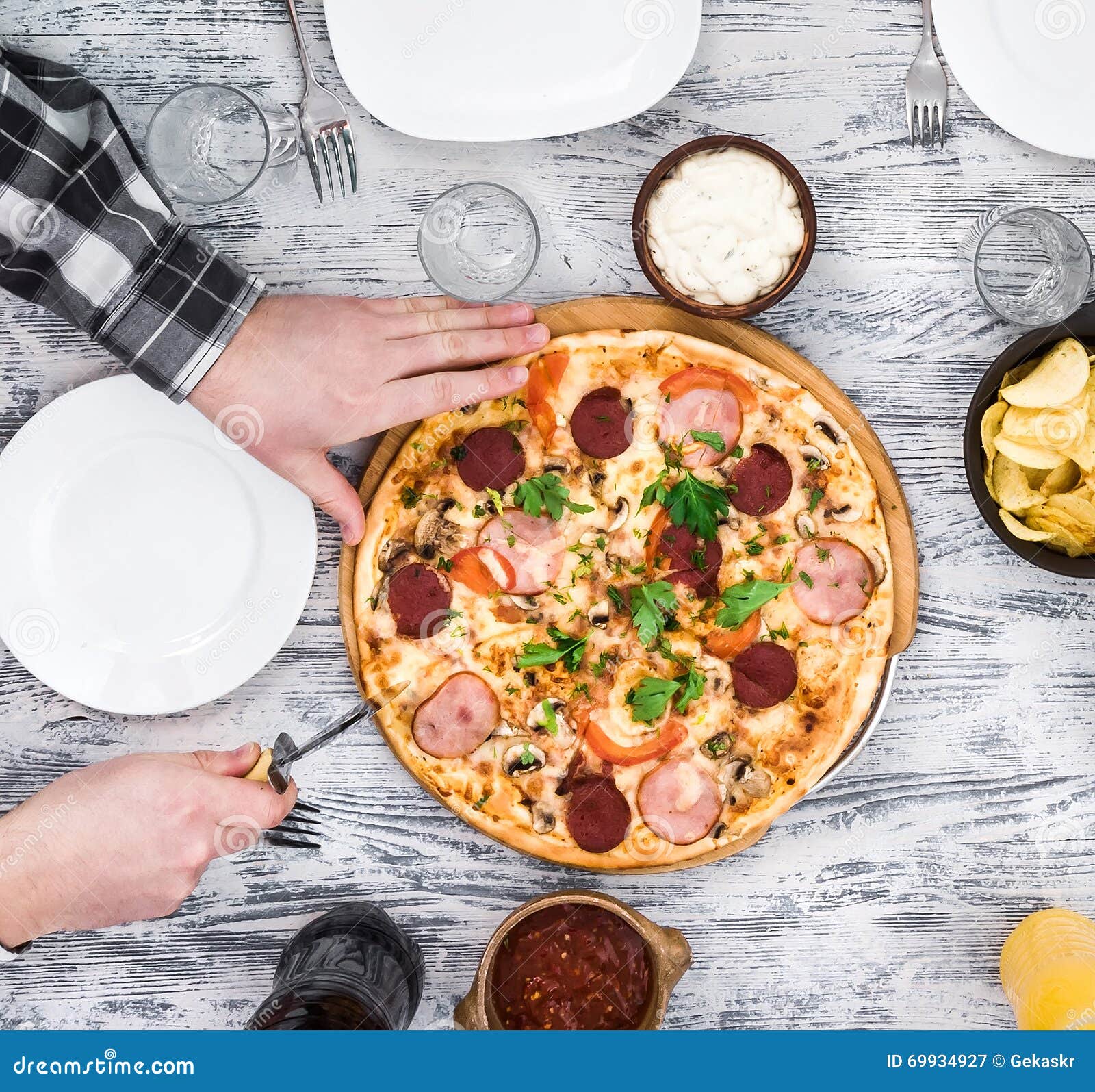 Hands Cutting Pizza on Table Stock Image - Image of piece, table: 69934927