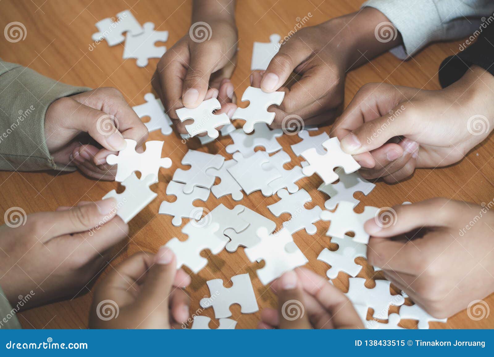Hands of Diverse People Assembling Jigsaw Puzzle, Team Put Pieces ...