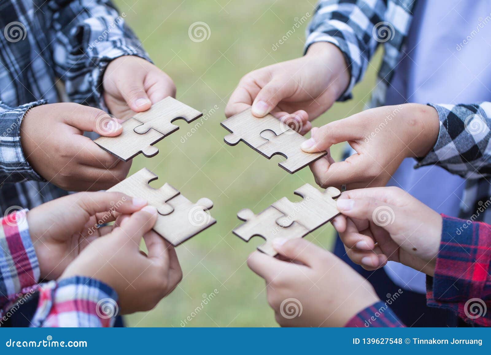Hands of Diverse People Assembling Jigsaw Puzzle, Team Put Pieces ...