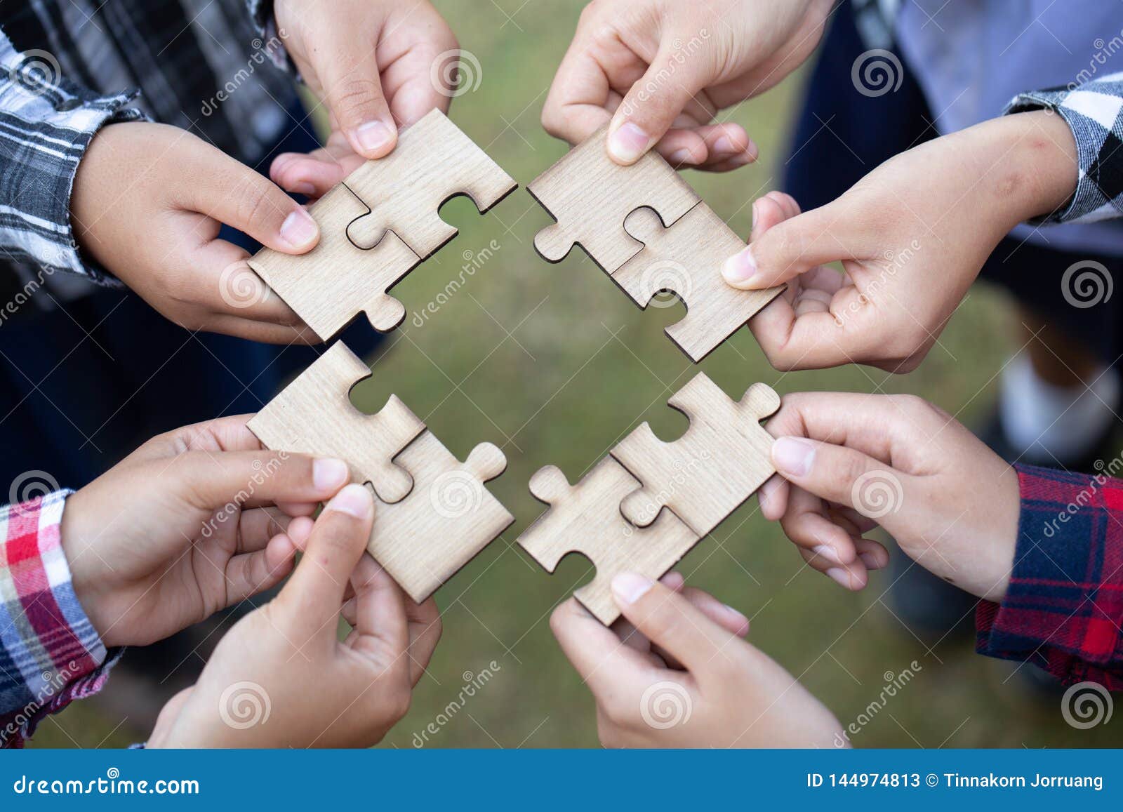 Hands of Diverse People Assembling Jigsaw Puzzle, Team Put Pieces ...