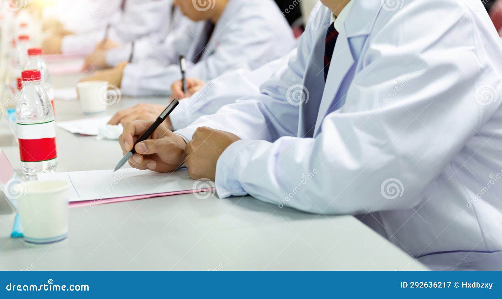 Hands of doctors writing stock image. Image of hand - 292636217
