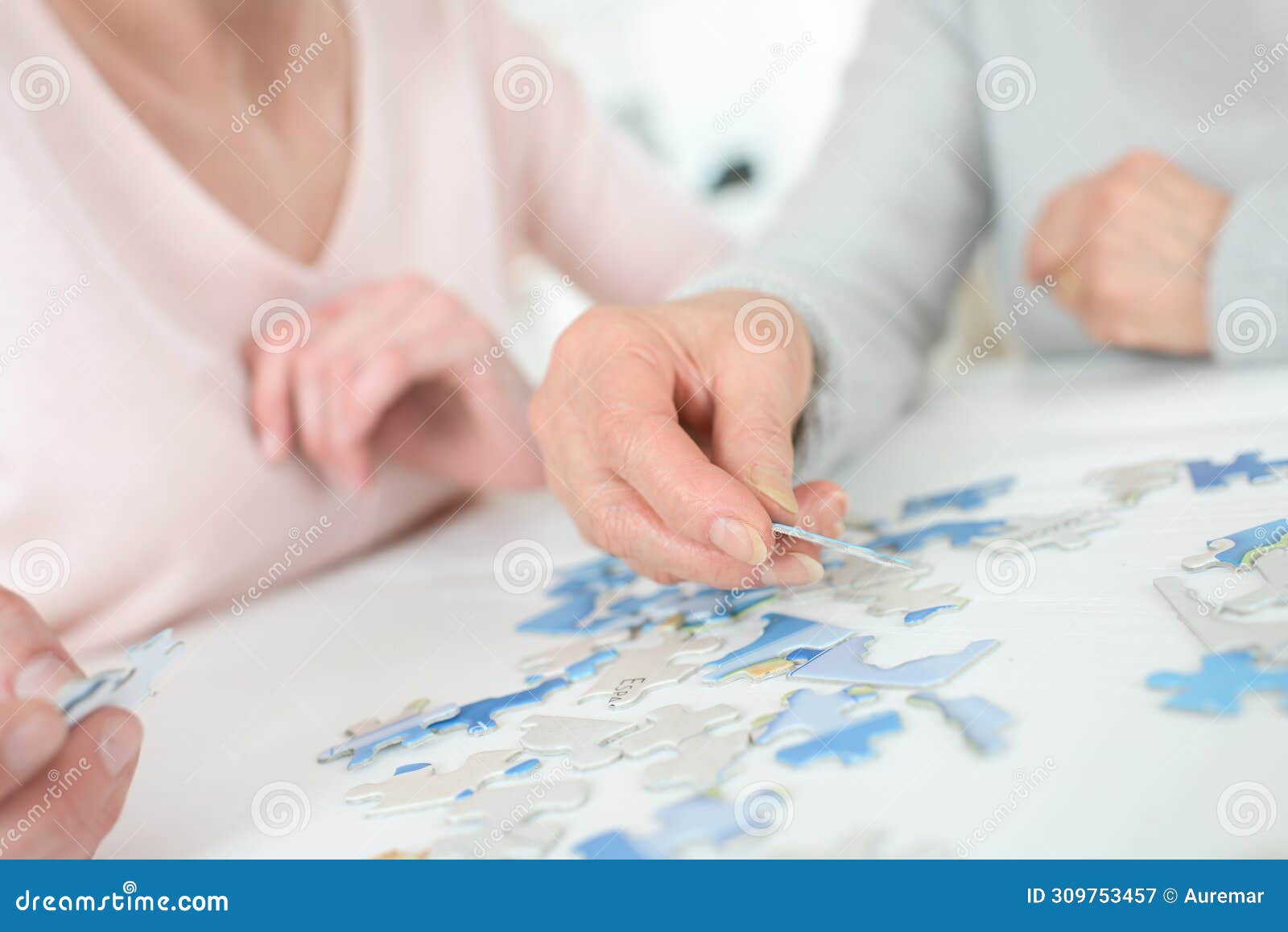 Hands doing puzzles stock image. Image of teamwork, white - 309753457
