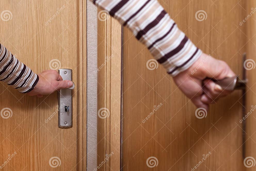 Hands and doors. stock image. Image of hand, wood, interior - 28562115
