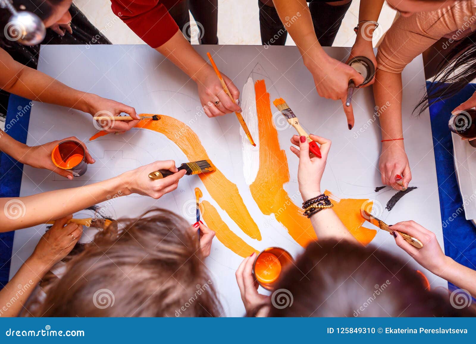 Hands Draw on the Poster, the Concept of Teamwork Stock Photo - Image ...