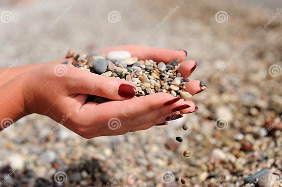 Hands Dropping Small Stones Stock Image - Image of pile, healthy: 57176213