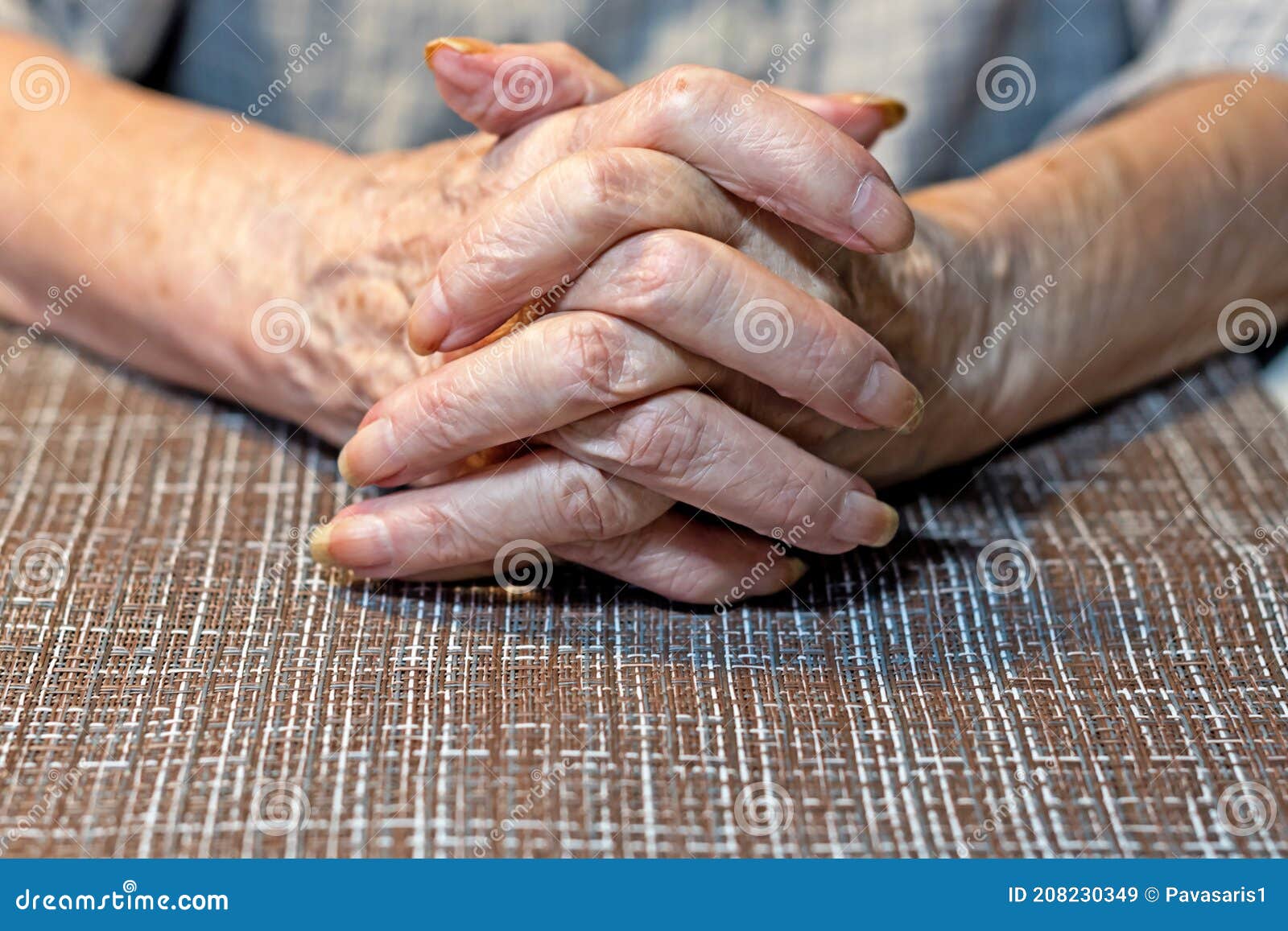 The Hands of an Elderly Woman Resting on the Table. Parkinson Stock ...