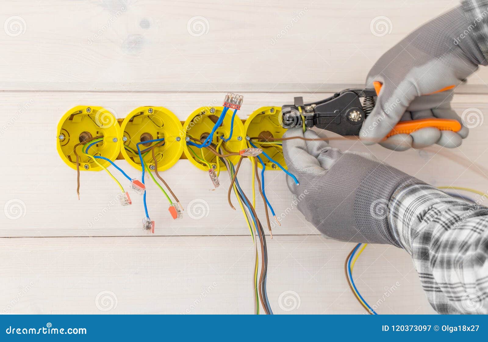 Hands of Electrician Installing Electrical Socket with Screwdriver in ...