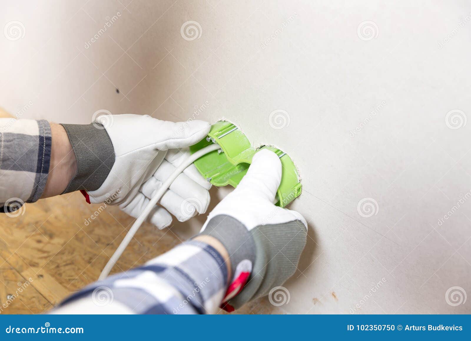 Hands of Electrician Installing Socket in Gypsum Wall Stock Photo ...