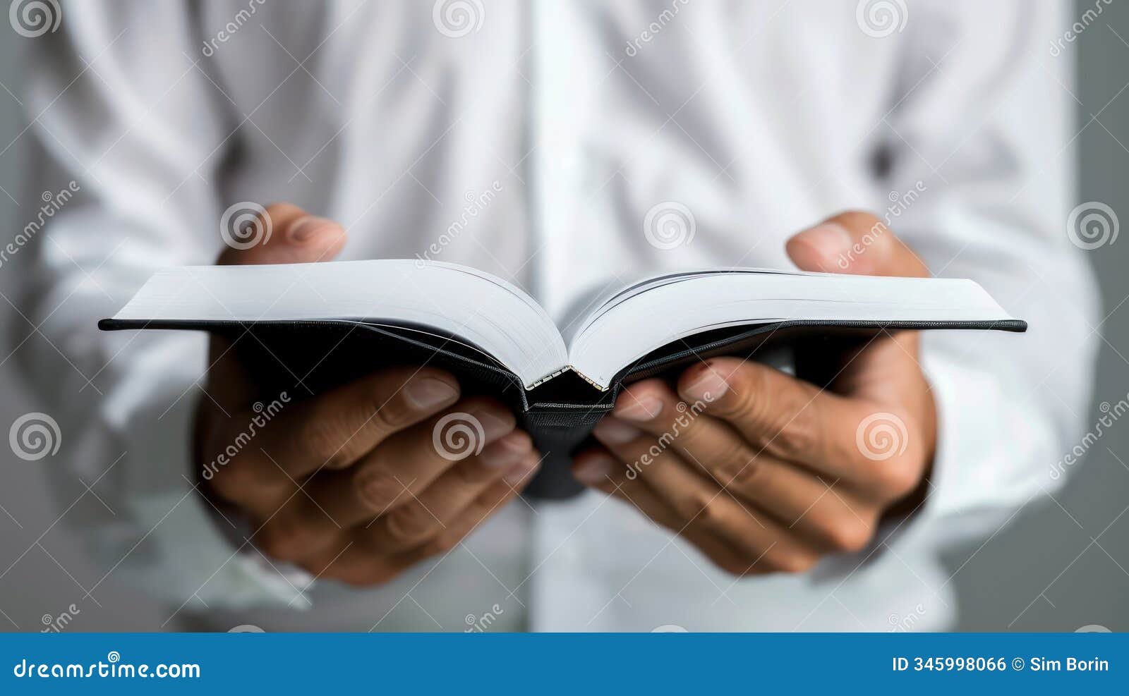 Hands of an Executive Reading a Guidebook on Good Governance Stock ...