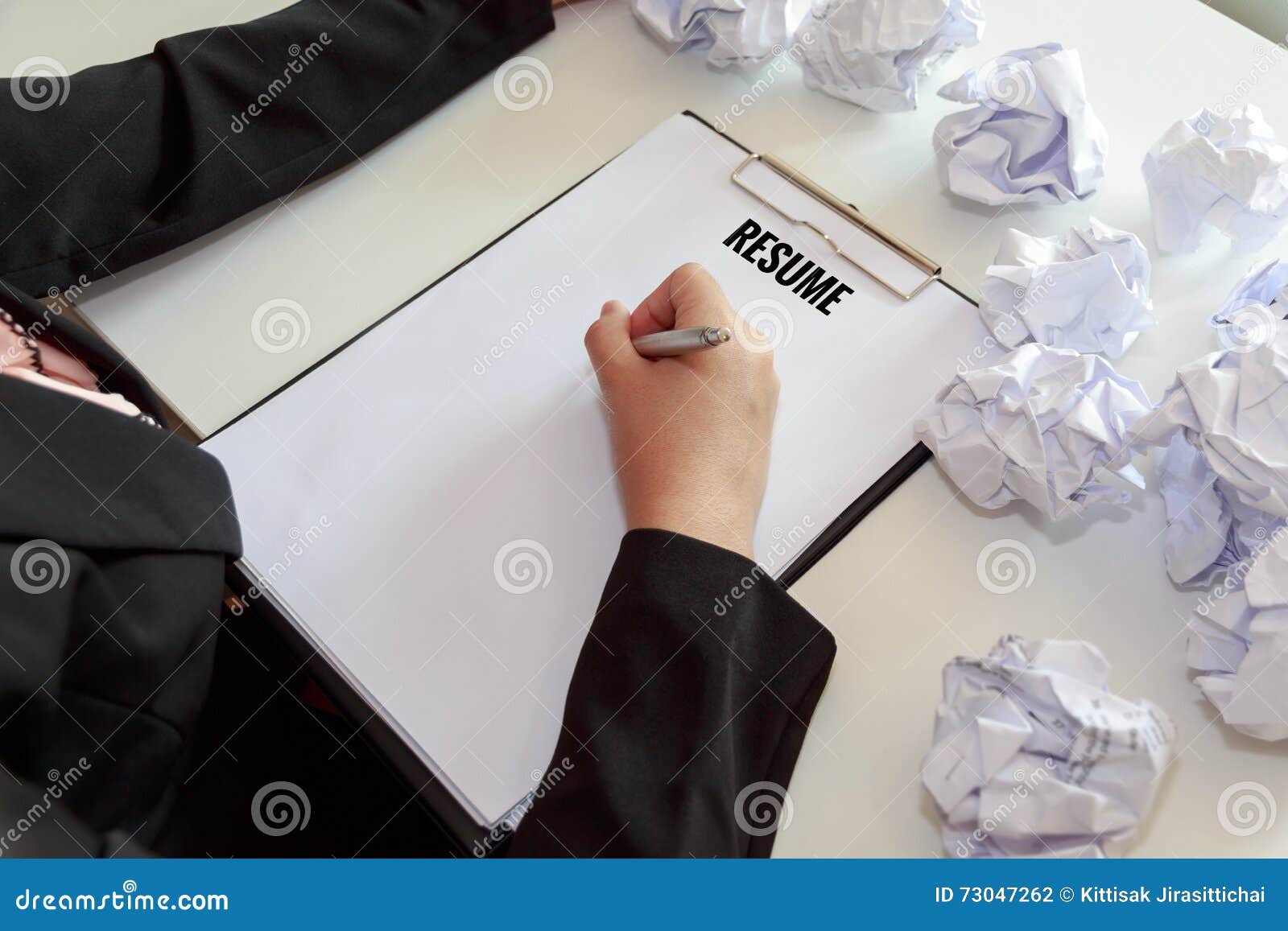 Hands of Female Writing Resume with Crumple Sheets of Papers at Stock ...