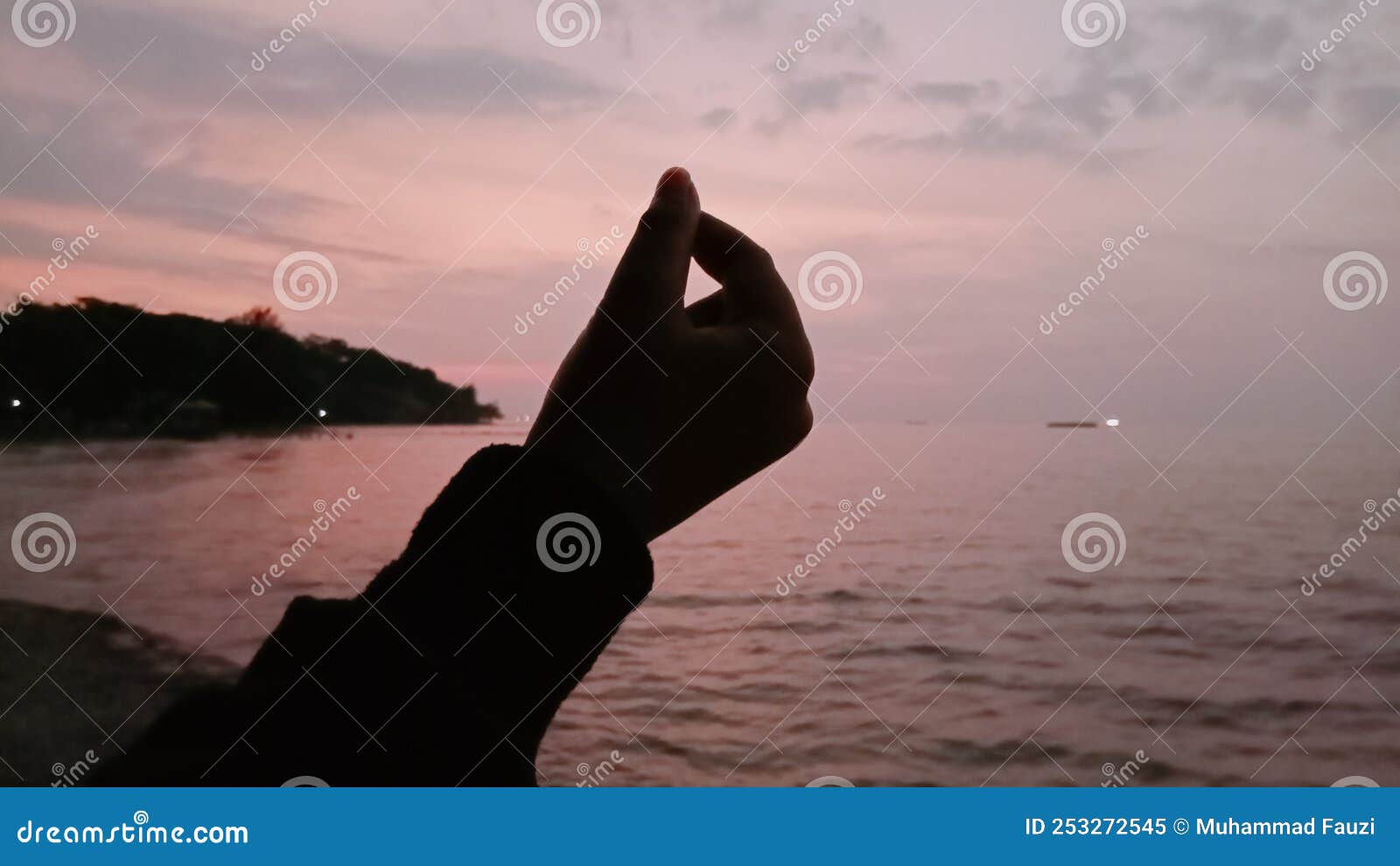 Hands and Fingers with a Beach Background in the Afternoon Stock Image ...