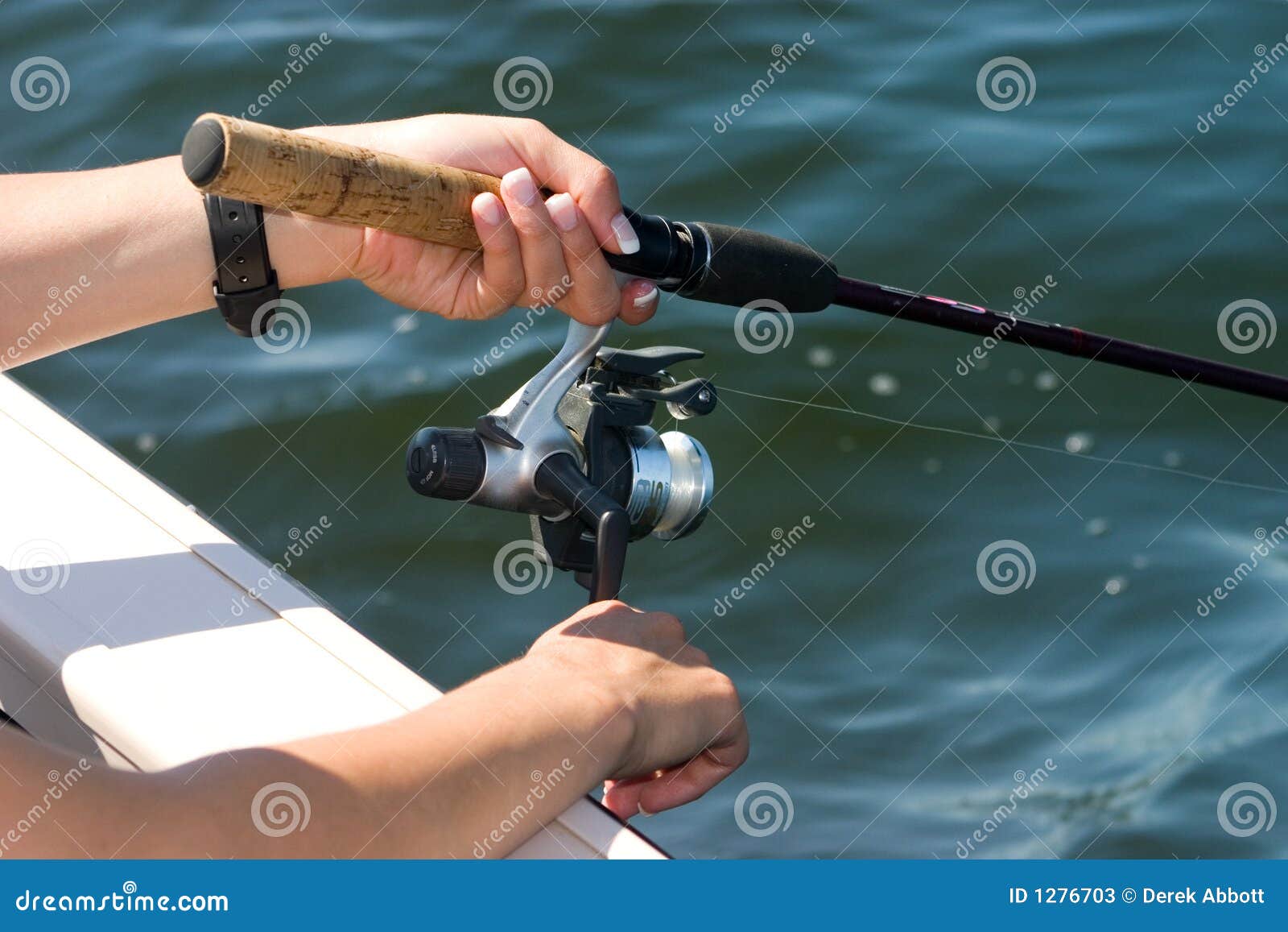 Hands on fishing reel stock image. Image of spinning, leisure - 1276703